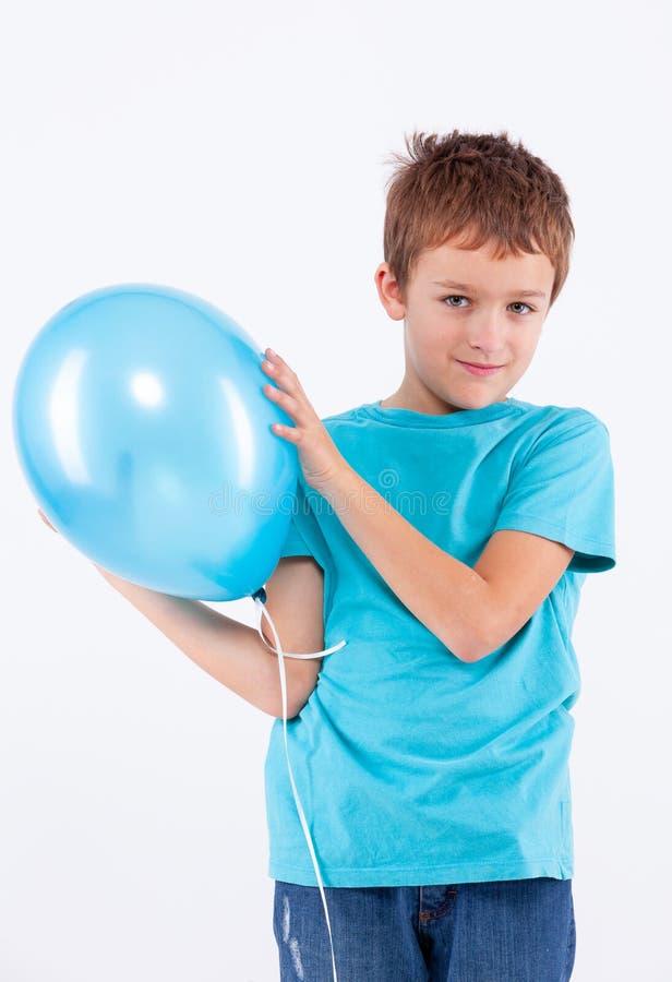 A Boy is Holding a Blue Balloon Stock Image - Image of background ...