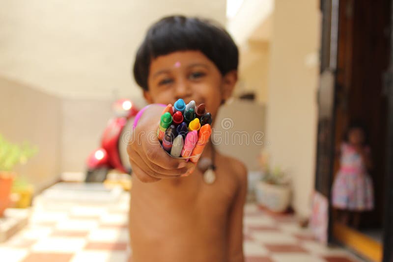 Boy Holding Crayons stock photo. Image of girl, food - 118290526