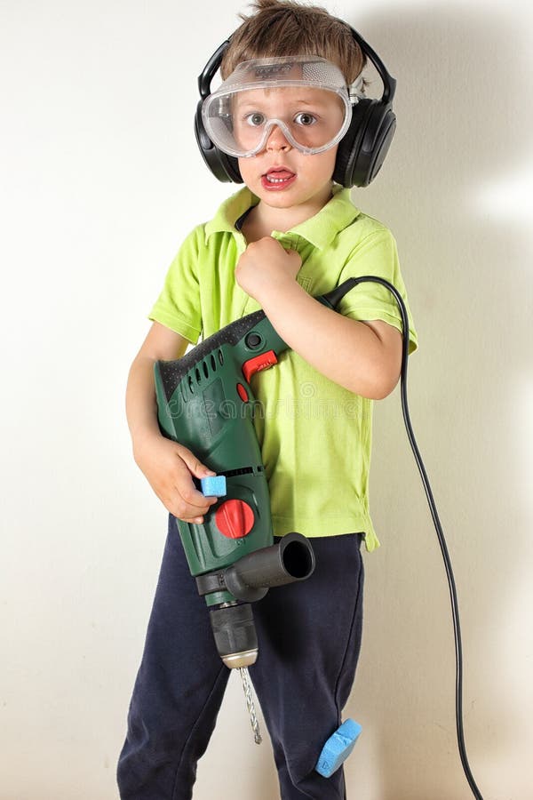 Boy Holding the Drilling Machine Ready To Drill Stock Image - Image of ...