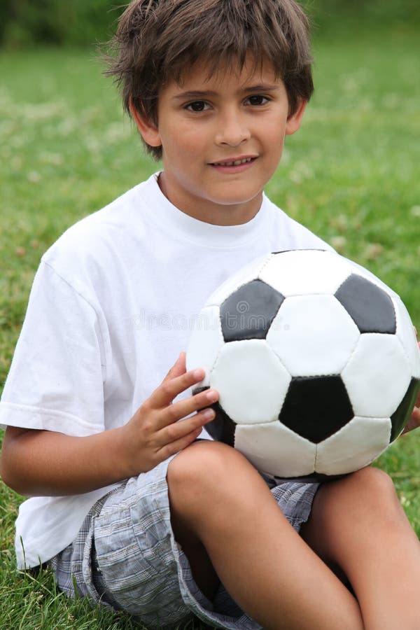 Boy holding football stock image. Image of healthy, ball - 28718767