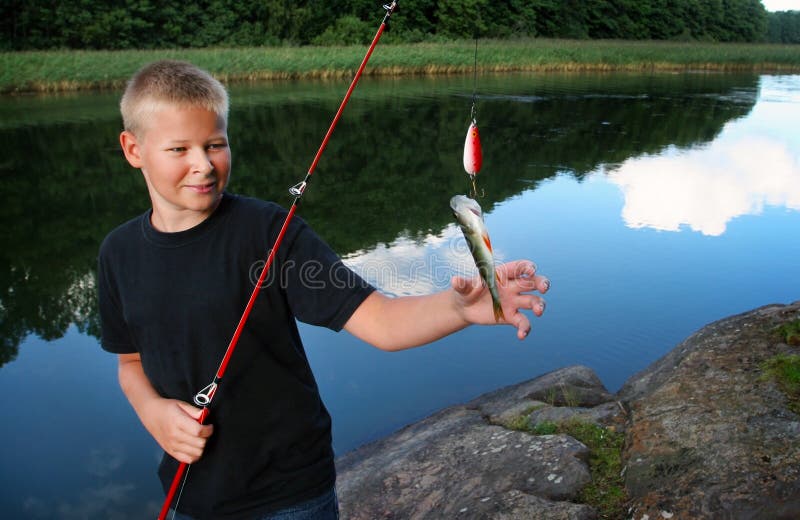 Boy holding his catch stock image. Image of fish, child - 28859187
