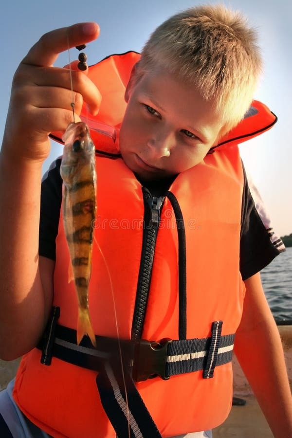 Boy Holding His Catch of the Day Stock Image - Image of sweat, catch ...