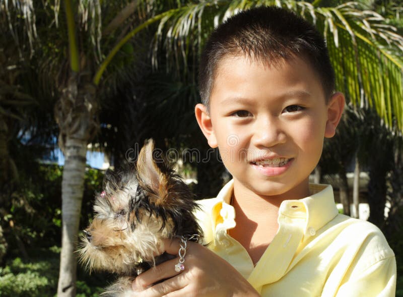 Boy Holding His Puppy Picture. Image: 6419673