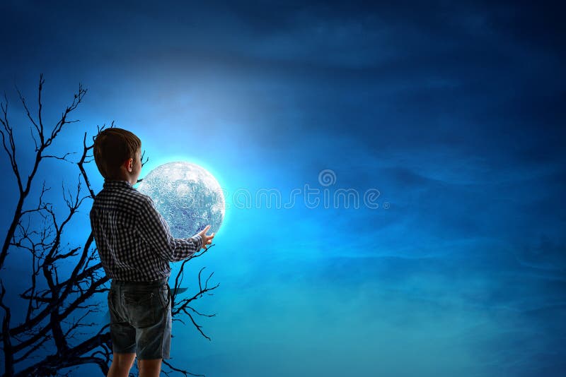 Boy holding moon at night stock photo. Image of full - 187211232