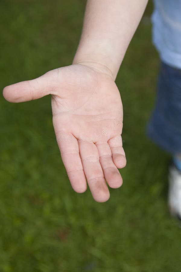 Boy holding out his hand stock photo. Image of request - 3300652