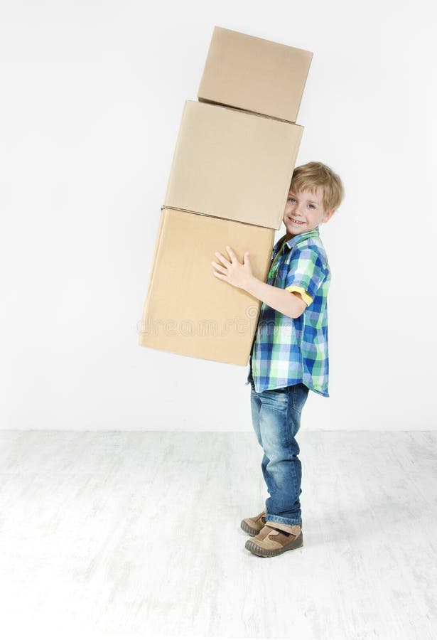 Boy Holding Pyramid of Carton Boxes. Packing Up Stock Photo - Image of ...