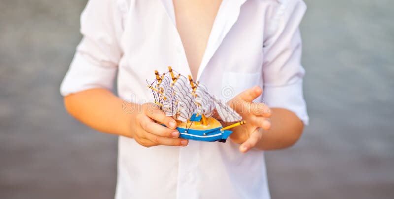 Boy Holding Toy Boat, Model of the Ship Stock Photo - Image of hand ...