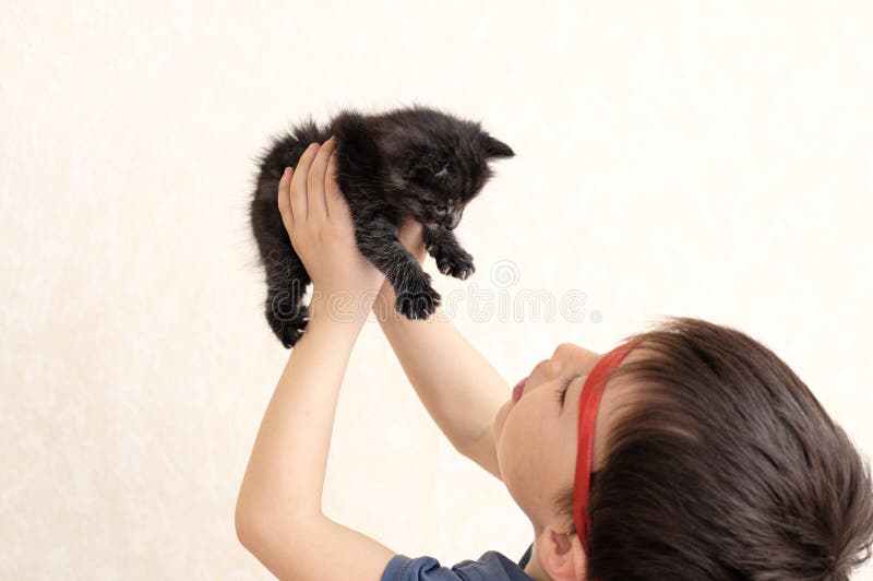 Boy Holding Up Black Kitten Stock Image - Image of frend, newborn: 70137505