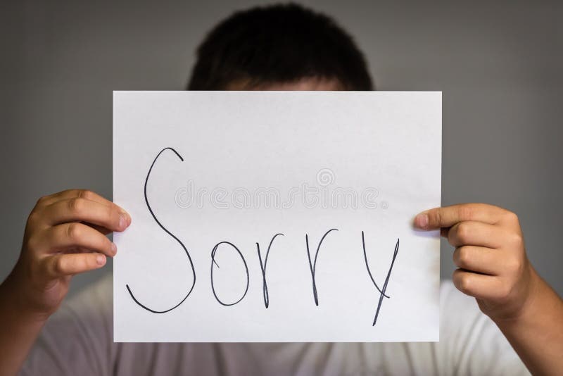 Boy Holding Up Sorry stock image. Image of finger, people - 98411835