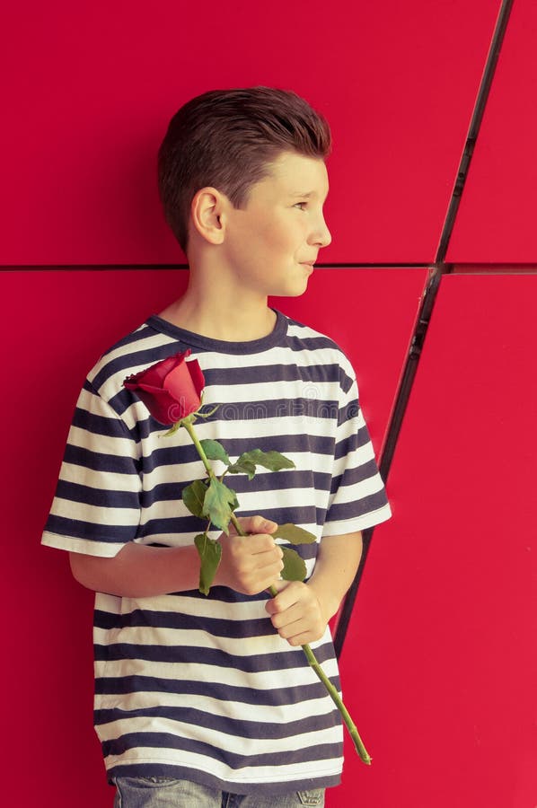 Boy Holding a Rose and Smiling. the Concept of Love Stock Image - Image ...