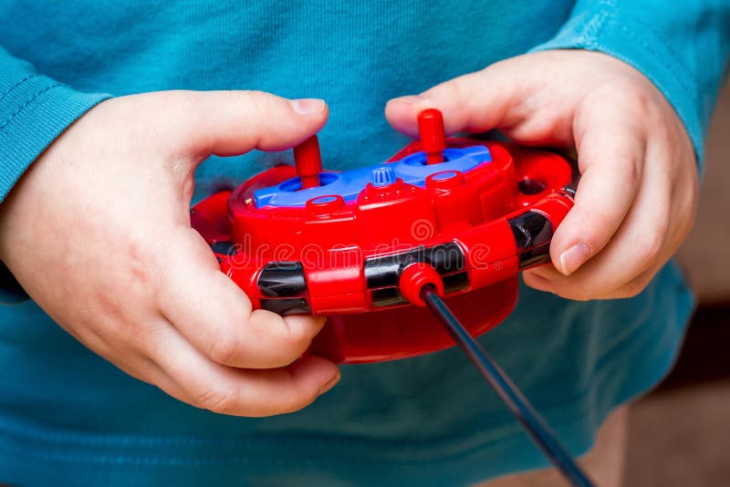 Boy Holds Toy Control Panel, Mastering Modern Technologies_ Stock Image ...