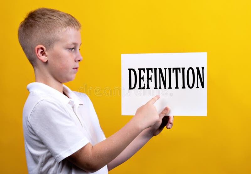 A Boy Holds a White Sheet with the Inscription DEFINITION on a Yellow ...