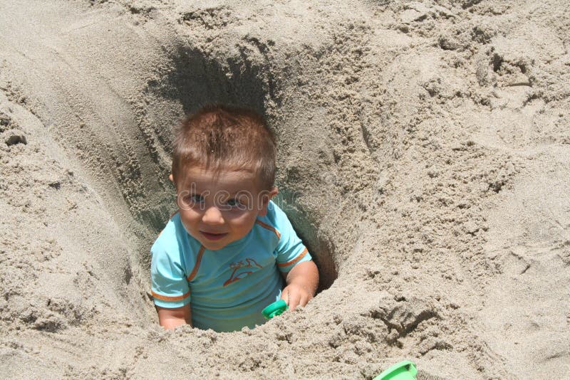 Boy Digging a Hole stock photo. Image of youth, summer - 20074662