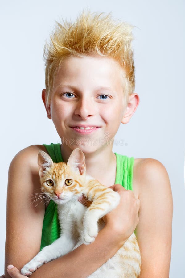 Boy hugging ginger kitten stock photo. Image of positive - 56324288