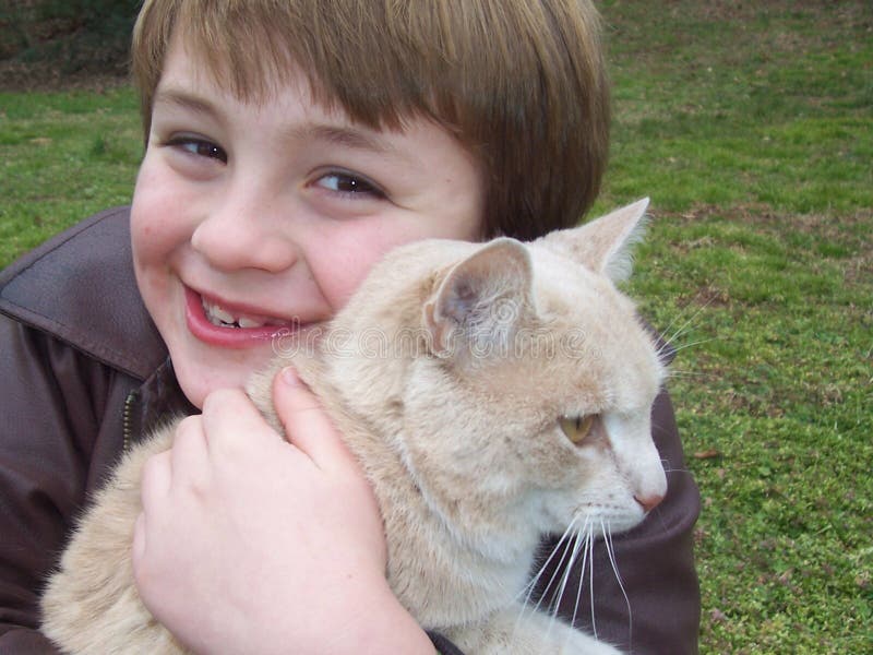 Boy hugging pet cat stock image. Image of smile, whiskers - 1992149