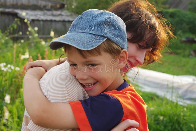 Boy hugs his mother stock photo. Image of family, baby - 13989240