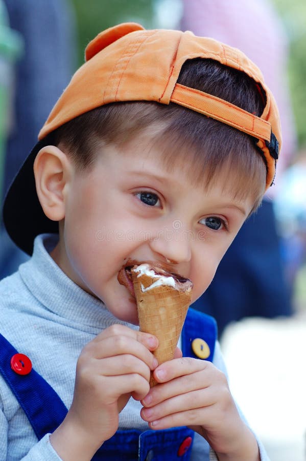 Boy with ice cream stock image. Image of walk, orange - 12553257
