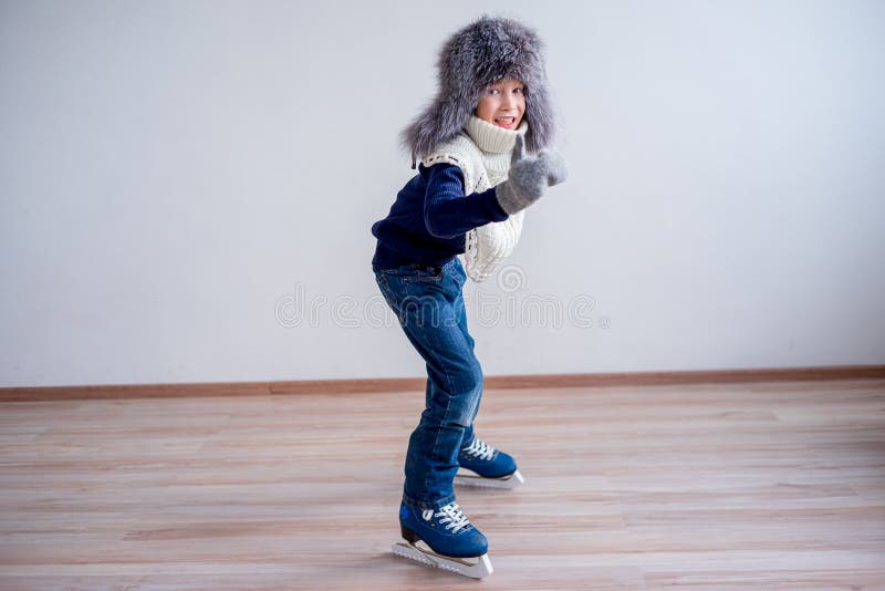 Boy in ice skates stock photo. Image of mittens, snow - 107450730