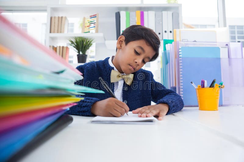 Boy Imitating As Businessman Writing on Paper Stock Photo - Image of ...