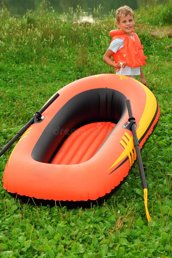 Boy and Inflatable Boat on Lawn Stock Image - Image of childhood ...