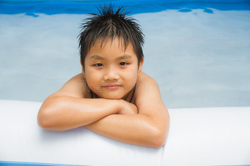 Boy and Inflatable pool stock image. Image of swim, activity - 39644217