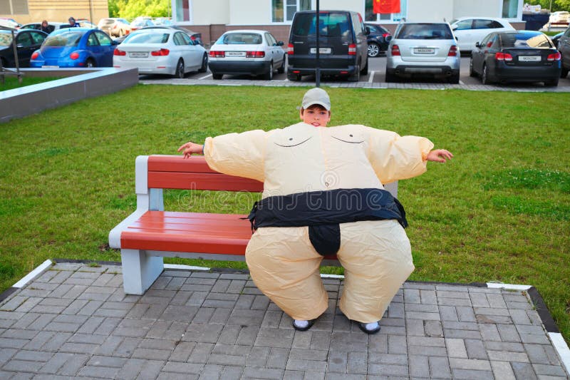 Boy in Inflatable Sumo Wrestler Suit Sitting on Stock Image - Image of ... Boy in Inflatable Sumo Wrestler Suit Sitting on Stock Image - Image of ...