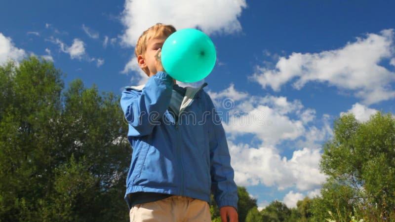 Boy Inflating Blue Balloon in Stock Footage - Video of healthy, young ...