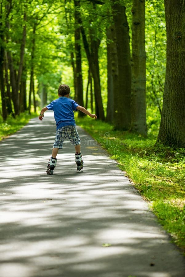 Boy on inline skates stock image. Image of skating, back - 41190707