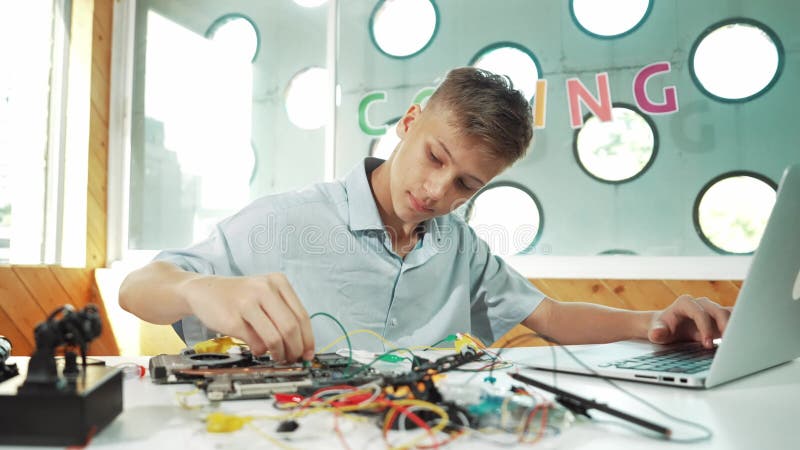 Boy Inspect or Learning To Use Electronic Tool To Fix Car Model ...