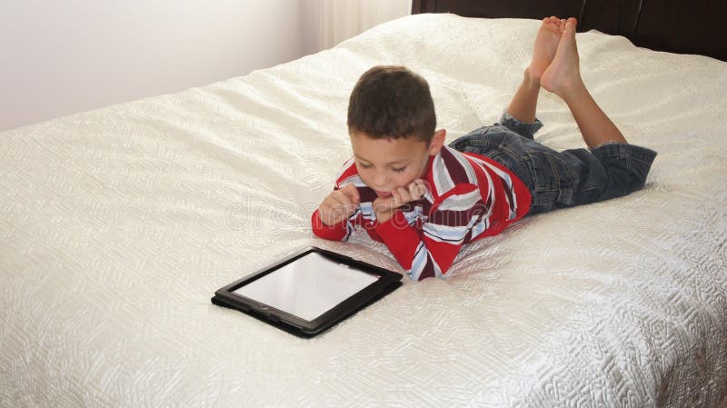 Boy with iPad stock image. Image of entertain, game, child - 29343227