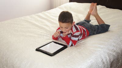 Boy with iPad stock image. Image of apple, development - 29343231