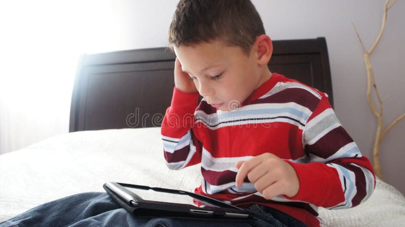 Boy with iPad stock image. Image of entertain, game, child - 29343227