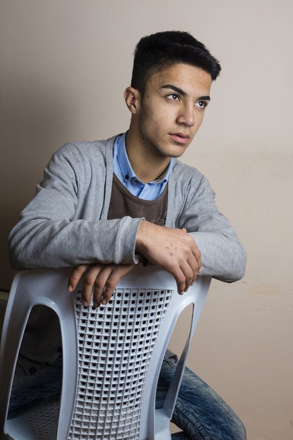 Boy Itting on Chair Inside Studio Stock Image - Image of chair, indoor ...