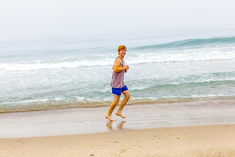 Boy is Jogging Along the Beautiful Beach Stock Image - Image of smile ...