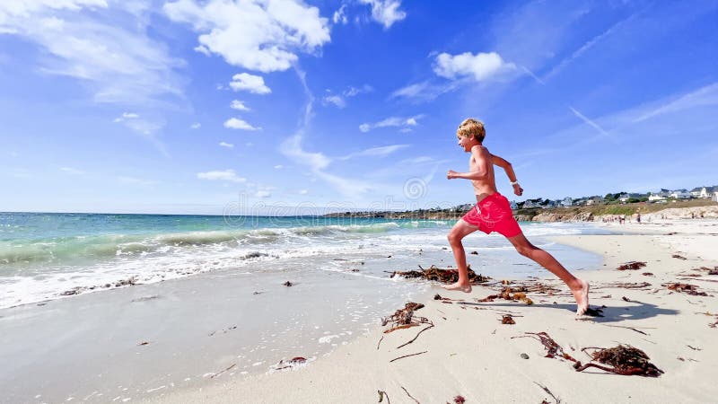 Boy Jump Running into Ocean Wave on the Summer Beach Stock Video ...