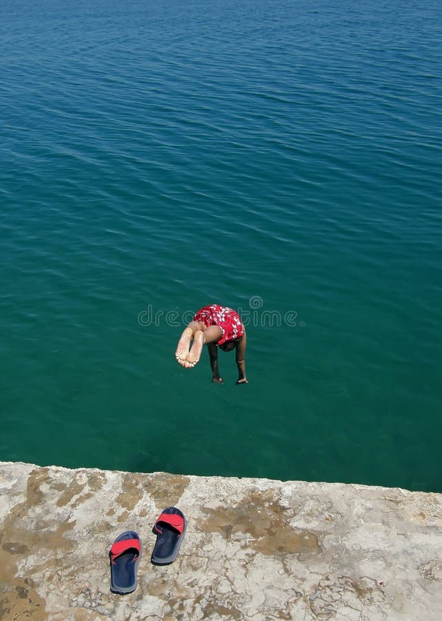 Boy jump in sea stock image. Image of height, bikini, diving - 9876553