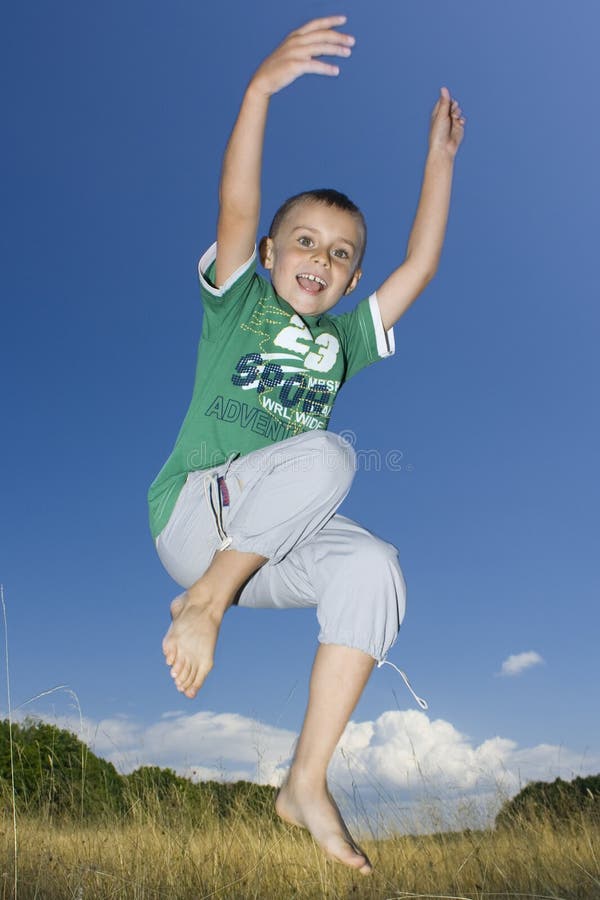 Boy jumping stock photo. Image of long, caucasian, expression - 6251834
