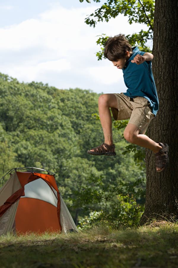 Boy jumping stock image. Image of jumping, holiday, family - 62563381