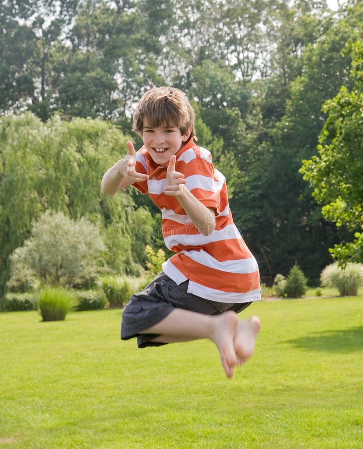 Boy Jumping stock photo. Image of play, adolescence, cloudy - 1498056