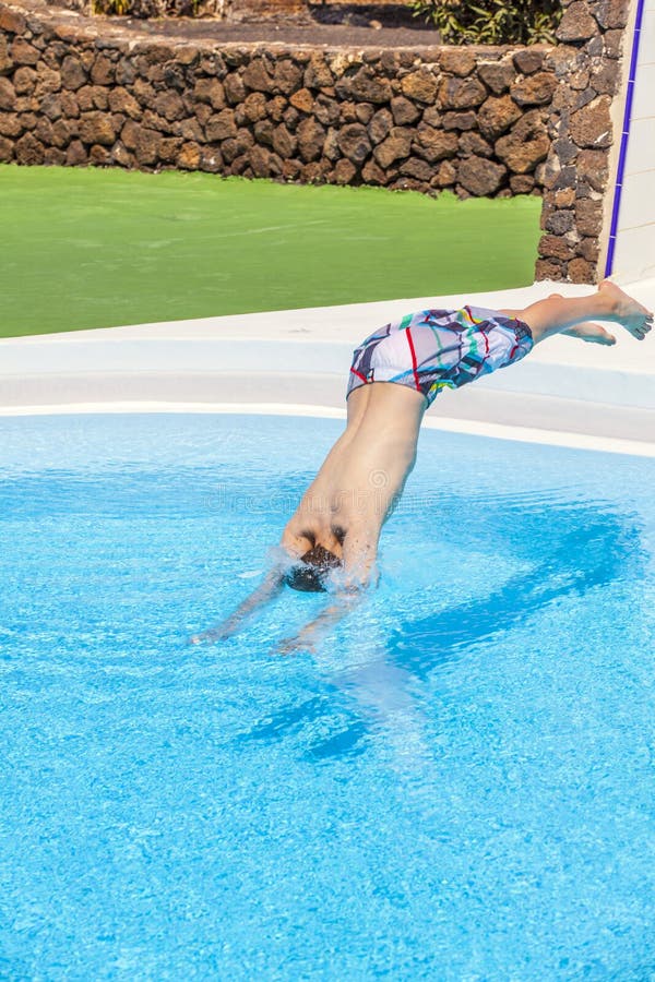 Boy Jumping in the Blue Pool Stock Image - Image of person, outdoor ...