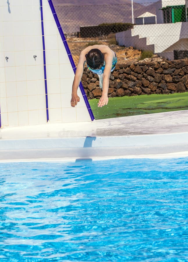 Boy Jumping in the Blue Pool Stock Image - Image of handsome, diver ...