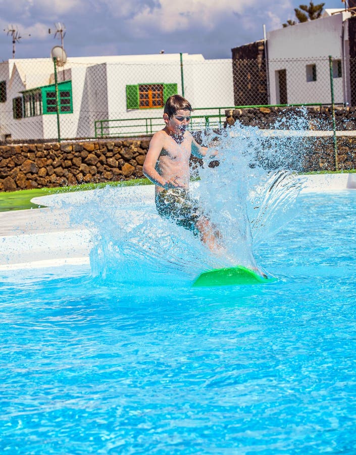 Boy Jumping in the Blue Pool Stock Image - Image of child, summer: 36078425