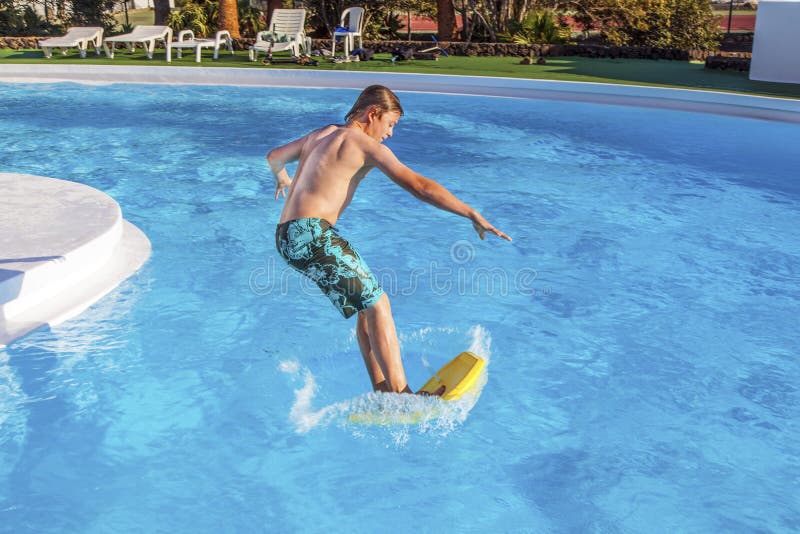 Boy Jumping in the Blue Pool Stock Photo - Image of landscape, diver ...