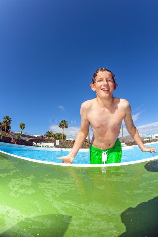 Boy Jumping in the Blue Pool Stock Photo - Image of outdoor, person ...