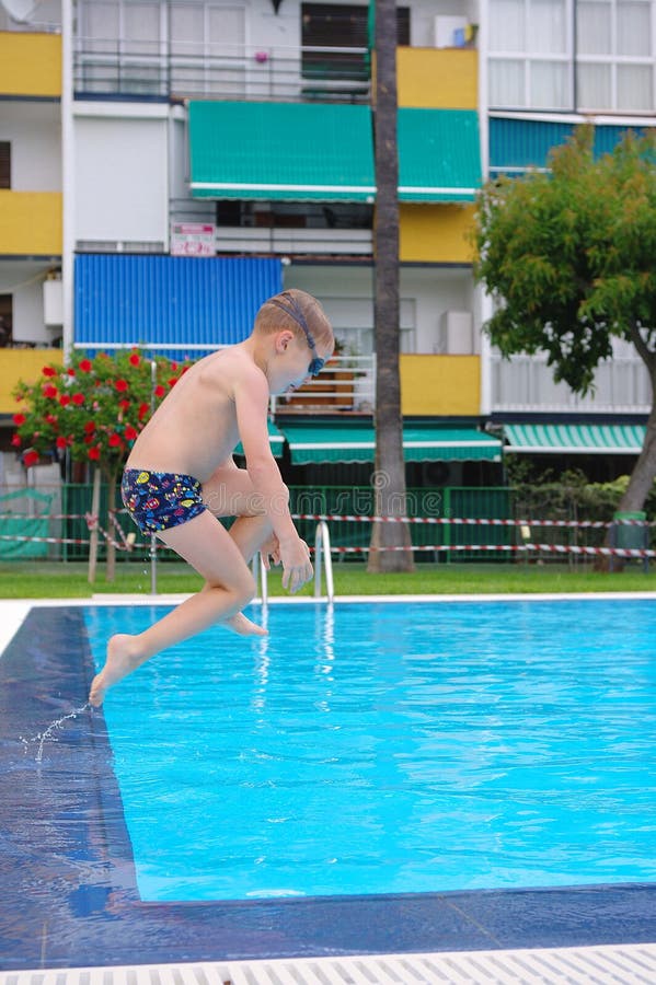 Boy Jumping in Cool Water of Swimming Pool Stock Image - Image of ...