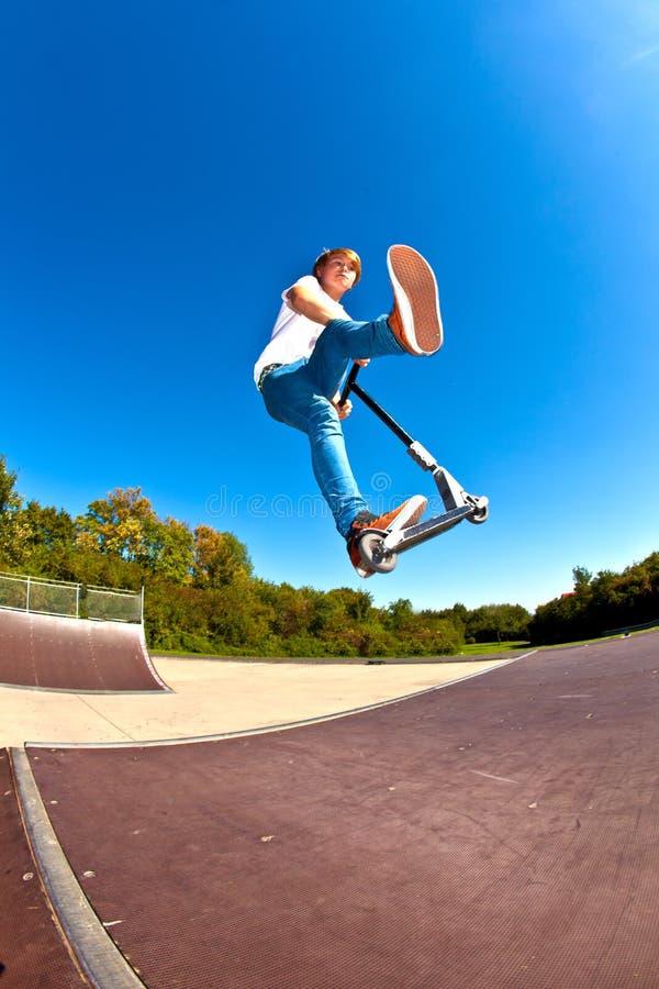 Boy Jumping with His Scooter Stock Photo - Image of children, exercise ...