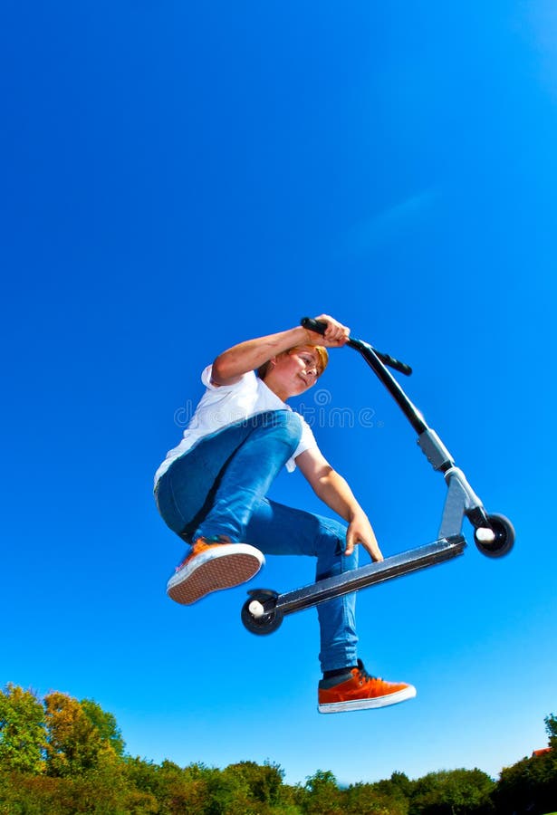 Boy Jumping with His Scooter Stock Image - Image of park, jump: 20819663