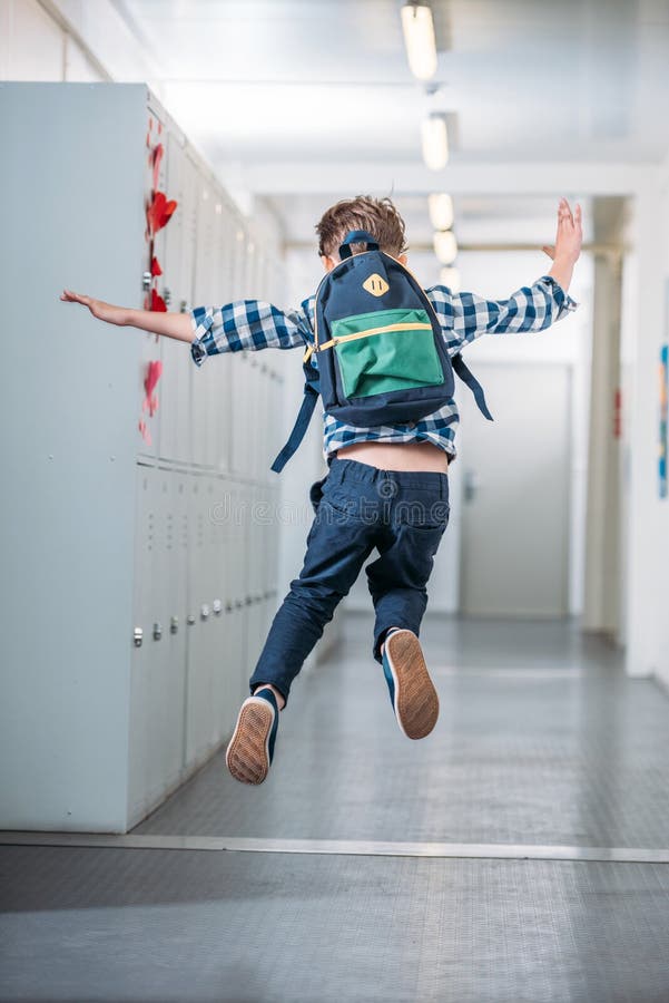 Back View of Little Boy Jumping Stock Photo - Image of student ...
