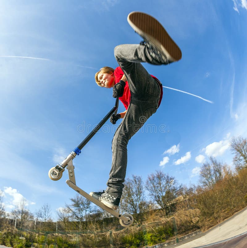 Boy Jumping with His Scooter Stock Image - Image of park, jump: 20819663 Boy Jumping with His Scooter Stock Image - Image of park, jump: 20819663