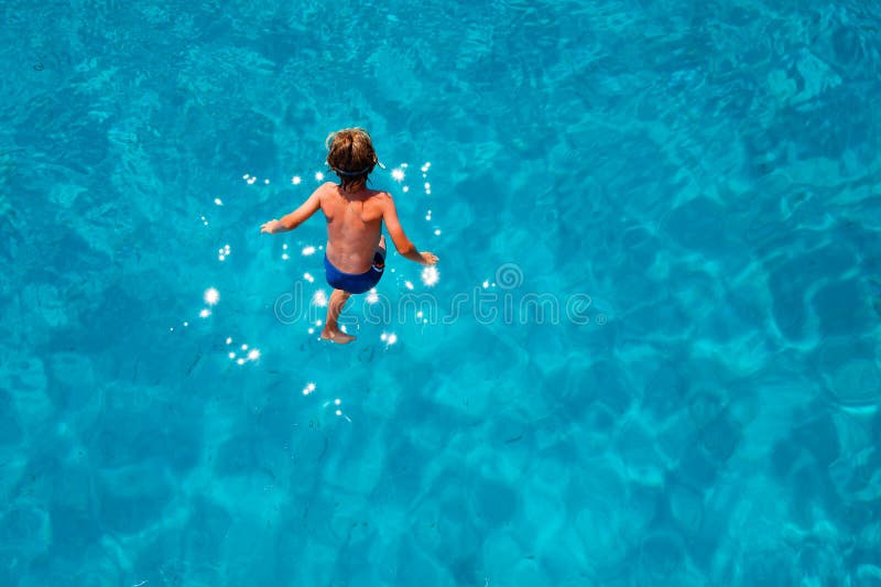 Boy jumping into sea water stock image. Image of relax - 20878027